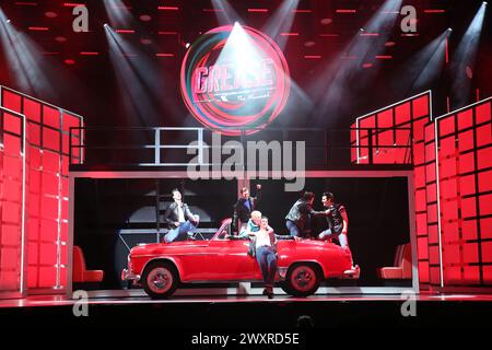 The cast of the musical Grease perform live on stage at West End Live ...