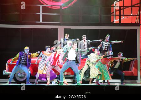 The cast of the musical Grease perform live on stage at West End Live ...