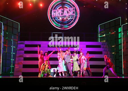 The cast of the musical Grease perform live on stage at West End Live ...