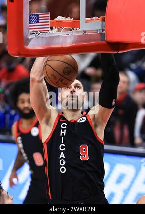 Chicago Bulls' Nikola Vucevic (9) dunks during the first half of an NBA ...