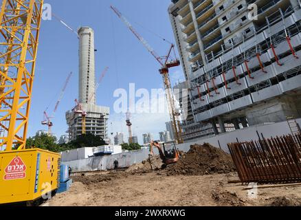A modern urban complex with three towers under construction in Kikar ...