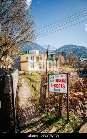 Name sign at the entrance to Nishaad Resorts, a hotel in Naddi village ...