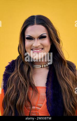 Portrait of a happy,smiling trans,transexual Filipina woman,sitting on ...