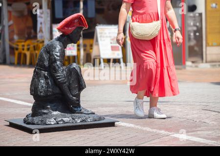 3 April 2024. A samsui woman statue display at Chinatown street ...