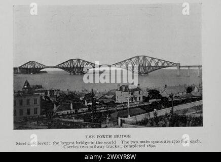 A large arched bridge spans across a lush green valley with a cityscape ...