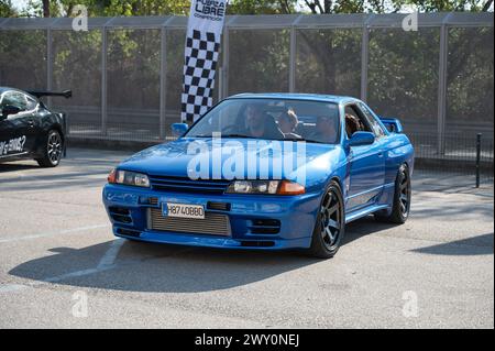 Front view of a blue eighth-generation Nissan Skyline GT R32 at a ...