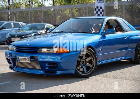 Front view of a blue eighth-generation Nissan Skyline GT R32 at a ...