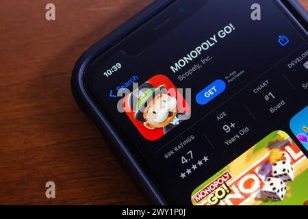 Monopoly Go! app seen in an iPhone screen. Monopoly Go! is a mobile ...