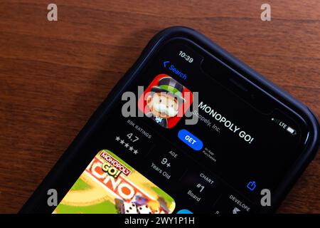 Monopoly Go! app seen in an iPhone screen. Monopoly Go! is a mobile ...