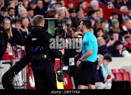Referee Andrew Madley checks the VAR screen during the Premier League ...
