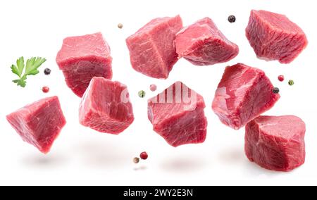Diced beef cuts levitating in air on white background. File contains ...