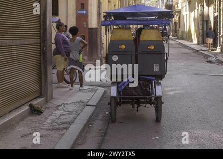 Bicitaxi Cuban people and lifestyle in the city, Holguin, Cuba Stock ...