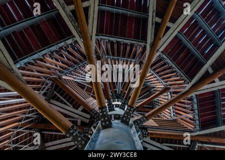 View of wooden observation tower taken from ground level looking up ...