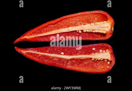 A red kapia pepper cut in two on a white background Stock Photo - Alamy