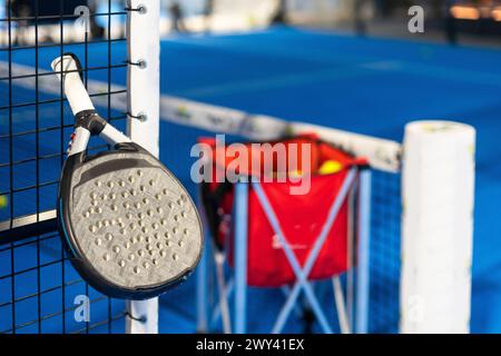 Paddle tennis rackets, balls and basket in court still life Stock Photo ...