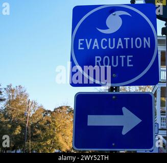 Warning sign indicating the evacuation route in case of a tsunami. Phi ...