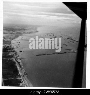 Aerial photographs show Mulberry B at Arromanches, a temporary harbor ...