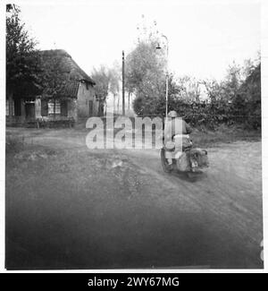 ENEMY BOOBY TRAPS. - Sgt. Wilson of the CMP passing harmlessly through ...