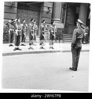 Lieutenant-General Sir Miles Dempsey takes the salute at a parade ...