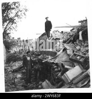 THE ENTRY INTO CAEN - Smashed up German tanks block the roadway in Caen ...