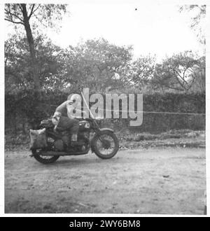 ENEMY BOOBY TRAPS. - Sgt. Wilson of the CMP passing harmlessly through ...