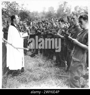 Reverend S. Cook conducts an open-air service for the 9th Cameronians ...