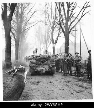 BRITISH TROOPS ENTER AND OCCUPY KLEVE - Bulldozer clearing the road ...