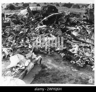 A DUMP FOR DAMAGED VEHICLES IN NORMANDY - Looking through a Churchill ...