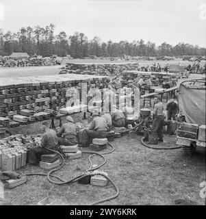 British Army personnel filling water tins from a bowser near the ...