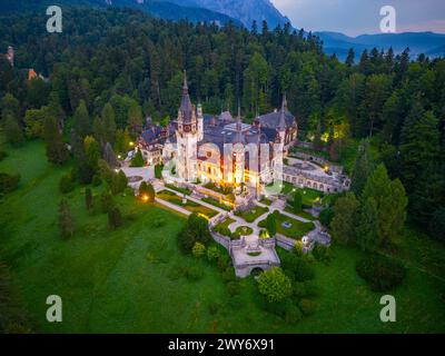 A night view of the illuminated Peles castle during winter Stock Photo ...