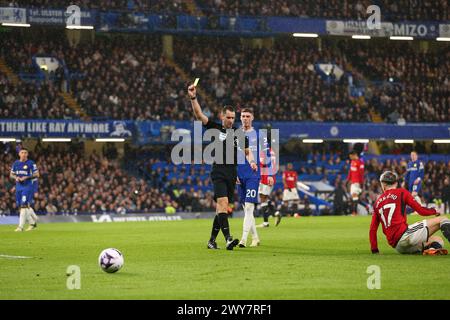 Referee Jarred Gillett shows a yellow card during the Tottenham Hotspur ...