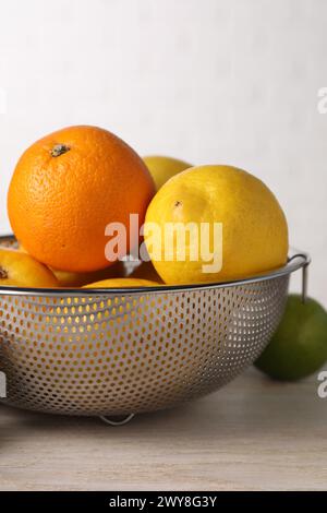 Colander with different fruits on white background Stock Photo - Alamy