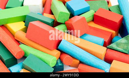A closeup of colorful wooden blocks for children on a white background ...