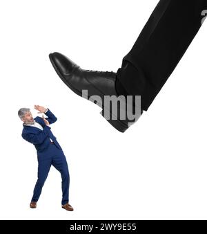 Giant stepping onto small man on white background Stock Photo - Alamy