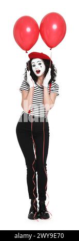 Funny mime artist with balloons posing on white background Stock Photo ...