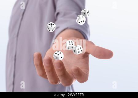 Man throwing dice on white background, closeup Stock Photo - Alamy