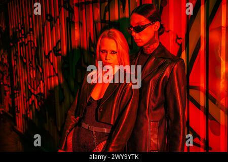 A couple of women standing side by side at a rave-party Stock Photo - Alamy