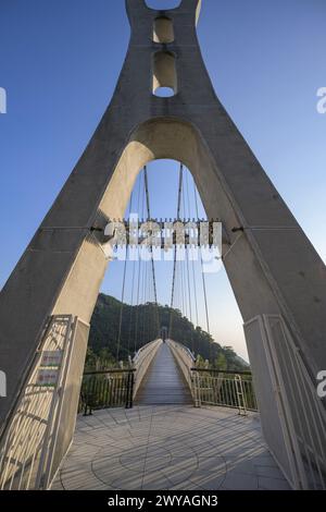 Modern Taiping suspension bridge with a distinct arch and cables ...
