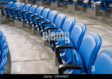 A long row of modern blue chairs with folding seats in a room Stock ...