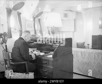 In April 1941, Captain J C Leach of HMS Prince of Wales reads the ...