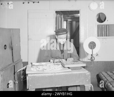 At HMS Cochrane, Rosyth, Scotland, a Royal Navy diver has his suit ...