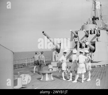 HMS Newcastle of the Eastern Fleet calibrates her guns near Trincomalee ...