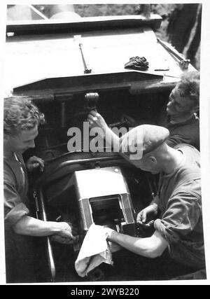 Original Caption: "Anti-tank gun covers the approach on a railroad ...