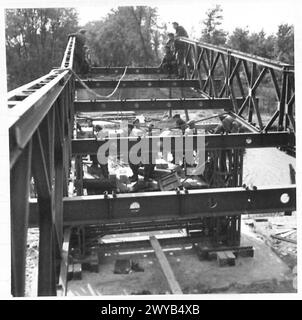 Soldiers of the 49th Division, 1st Corps, B.L.A., position bridge ramps ...
