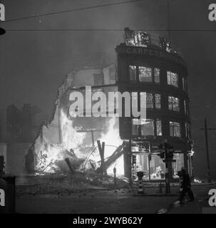 The Manchester Blitz Buildings burning in Manchester after a German air ...