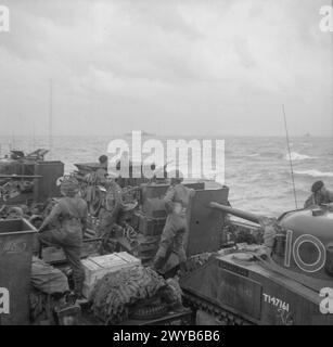 A Sherman BARV (Beach Armoured Recovery Vehicle) and Sherman tanks of ...