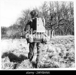 ARMY'S SIGNAL EQUIPMENT - Original wartime caption: SCR 300. (One man ...