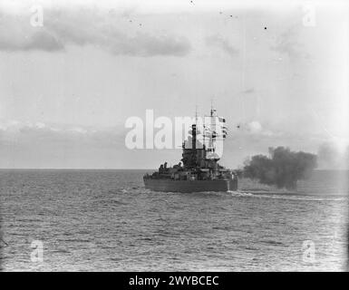 ON BOARD THE BATTLESHIP HMS RODNEY AT SEA. 1940. - HMS NELSON firing ...