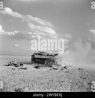A German PzKpfw III tank destroyed in Tunisia with the body of a crew ...