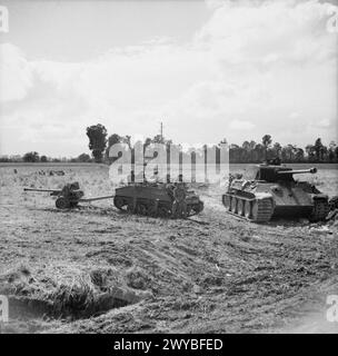 Soldiers of the 49th Division, Durham Light Infantry, take a hasty meal ...